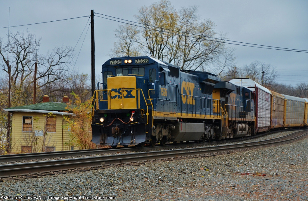 CSX 7526 passes the ever more decrepit AY Tower and yard office.